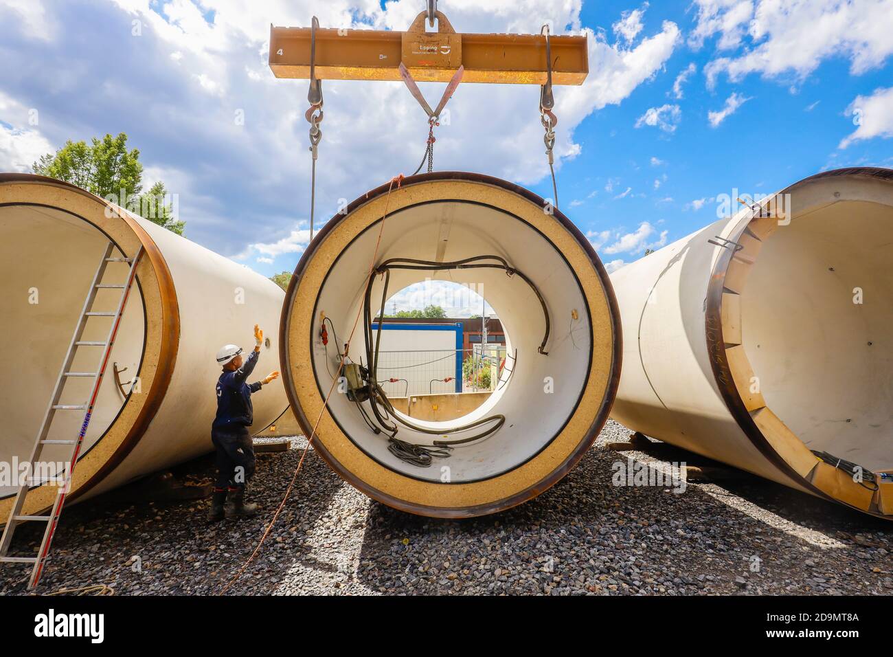 Crane lifting pipes hi-res stock photography and images - Alamy
