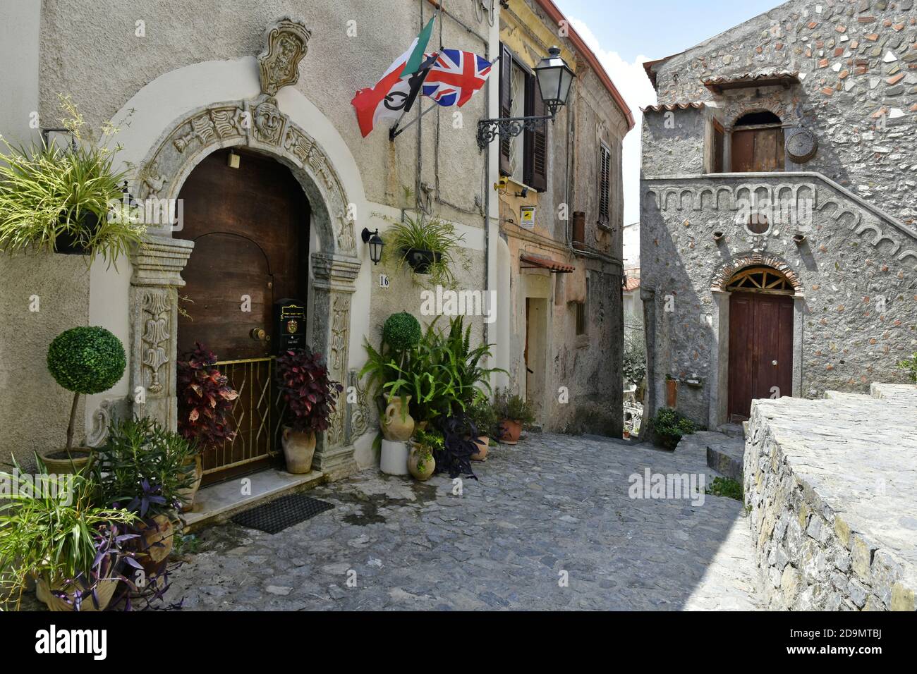 A narrow street among the old houses of Scalea, a rural village in the ...