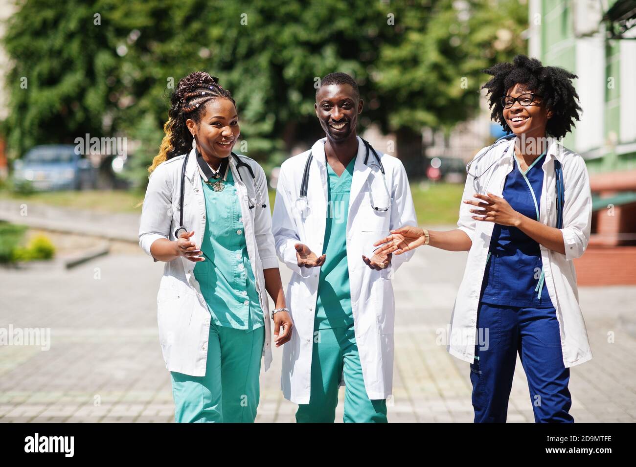 Three African American group doctors with stethoscope wearing lab coat ...