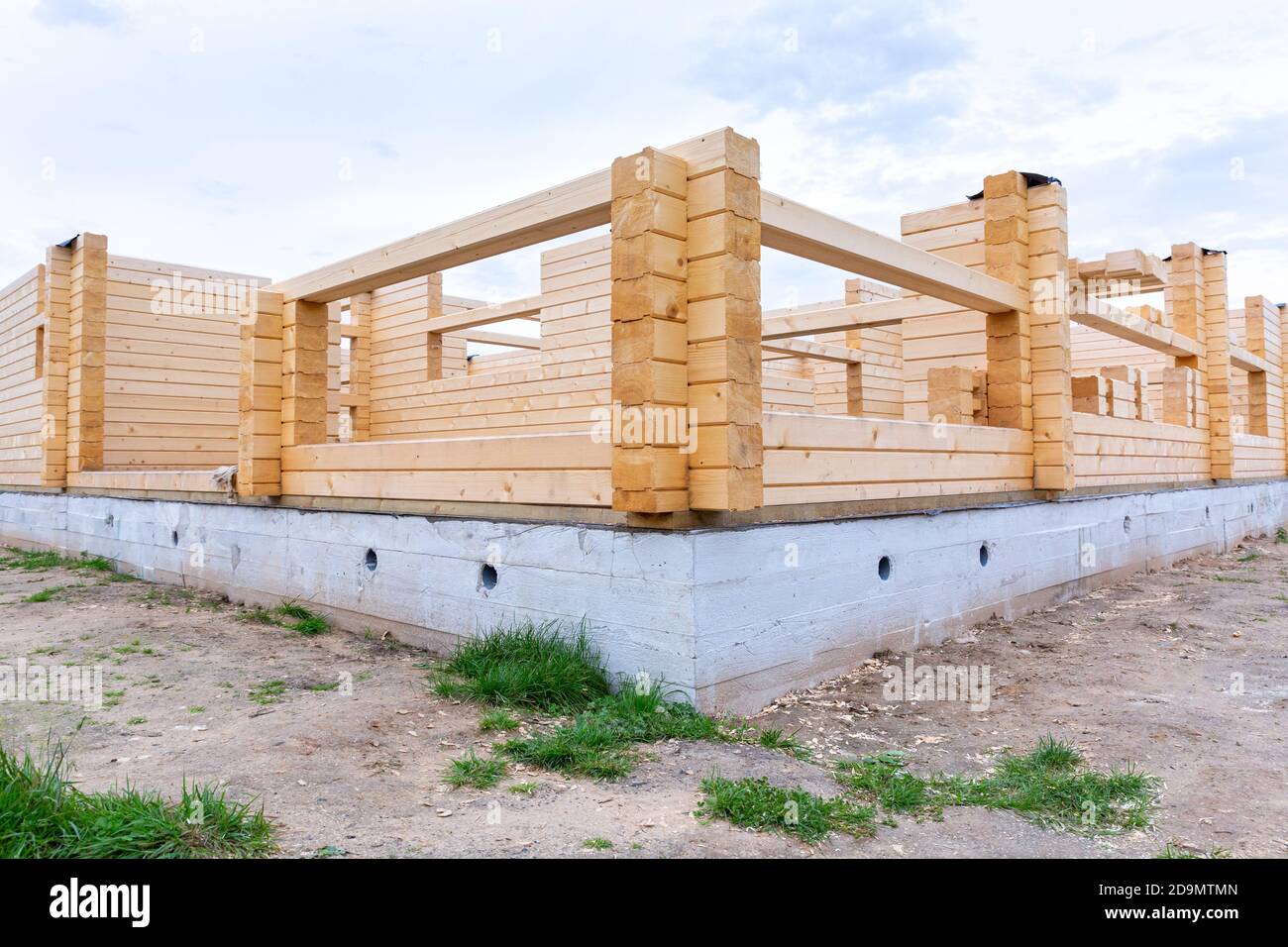 Construction of a wooden house on a cement base, foundation. Start of ...
