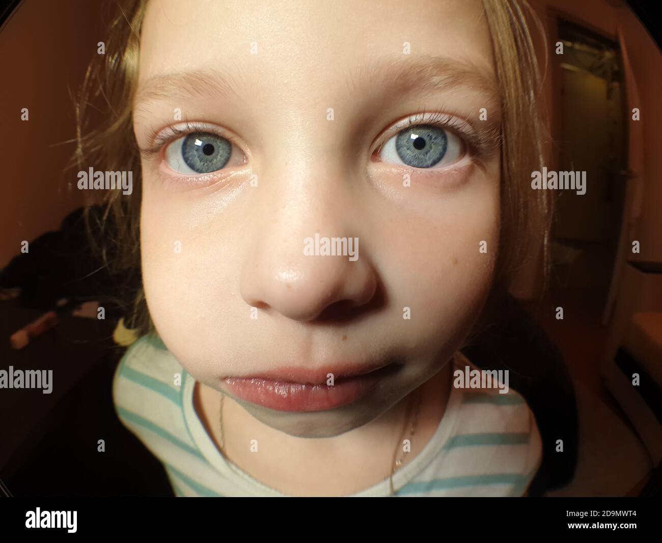 funny children's portrait, portrait of a little girl close-up on a wide ...