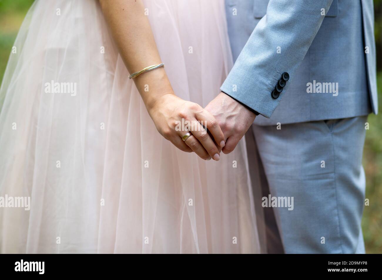Pregnant bride with the groom on their wedding day Stock Photo - Alamy