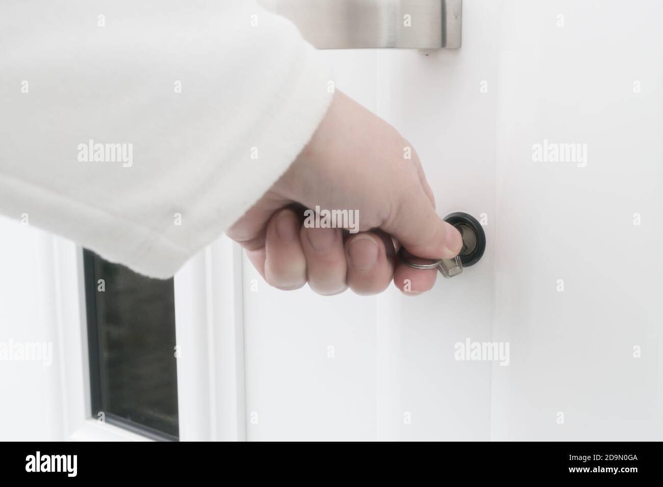 Person opening the front door with a key Stock Photo - Alamy