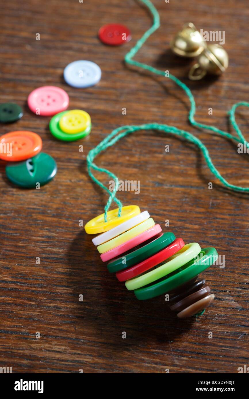 STEP 4. Making a button Christmas tree decoration. After the trunk ...