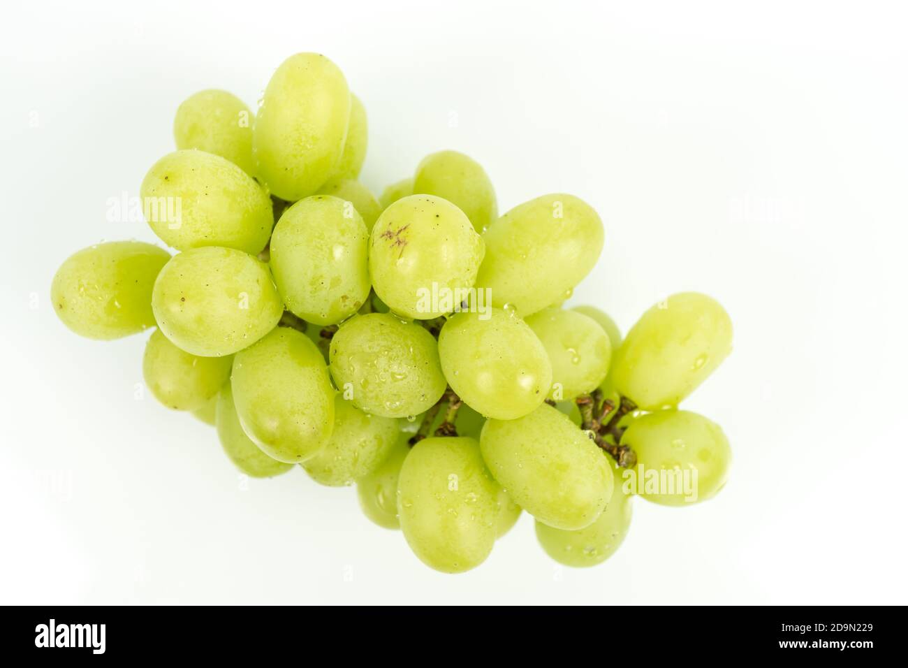 Green grapes isolated on a white background Stock Photo - Alamy