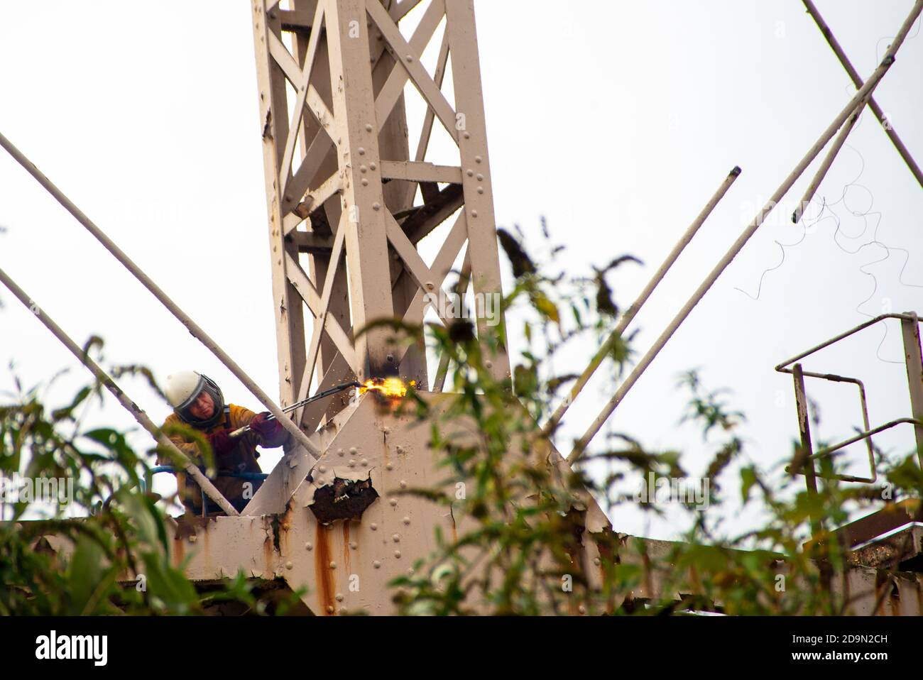 A demolition worker uses an oxy-acetylene torch to cut up a Victorian ...