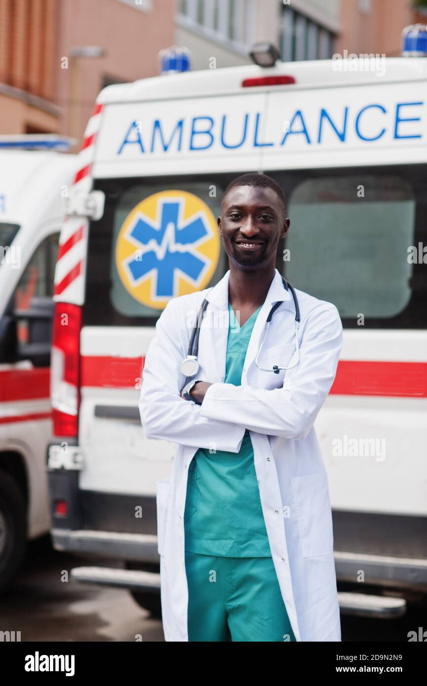African male paramedic standing in front of ambulance car Stock Photo ...