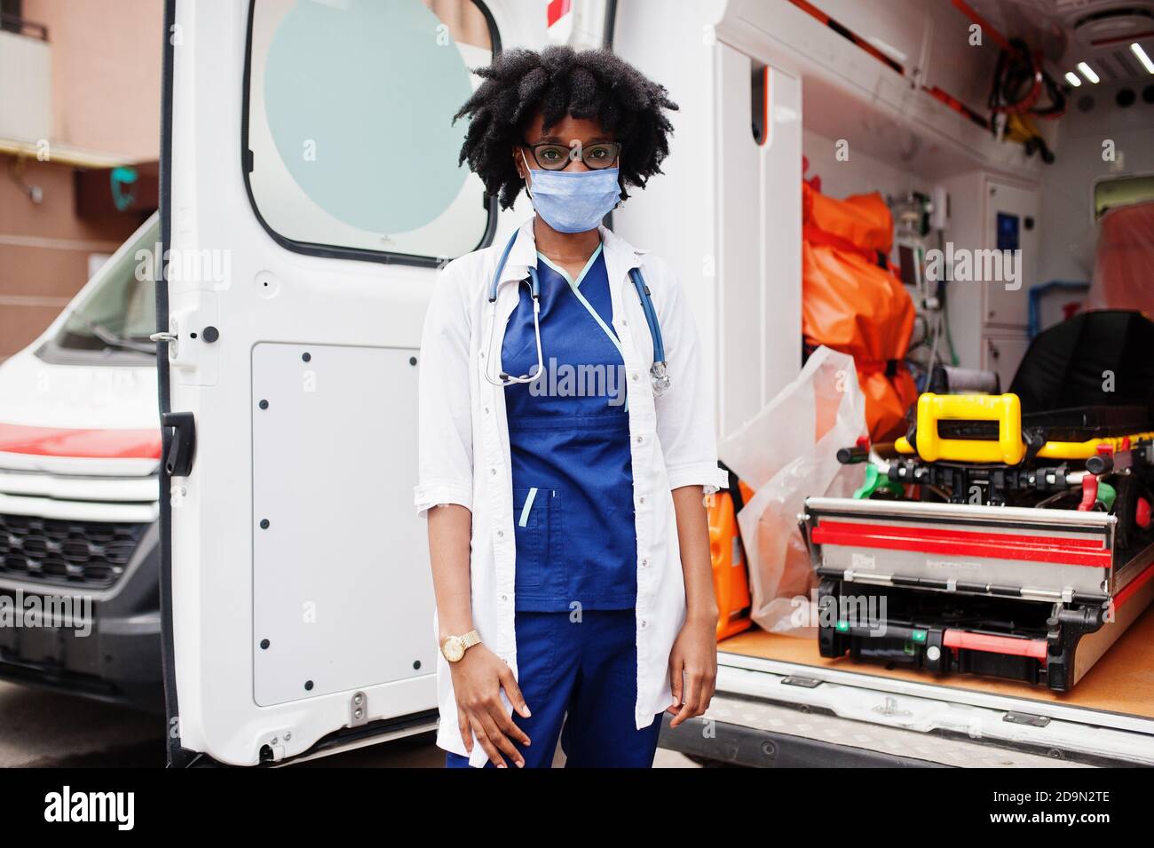 African american female paramedic in face protective medical mask ...
