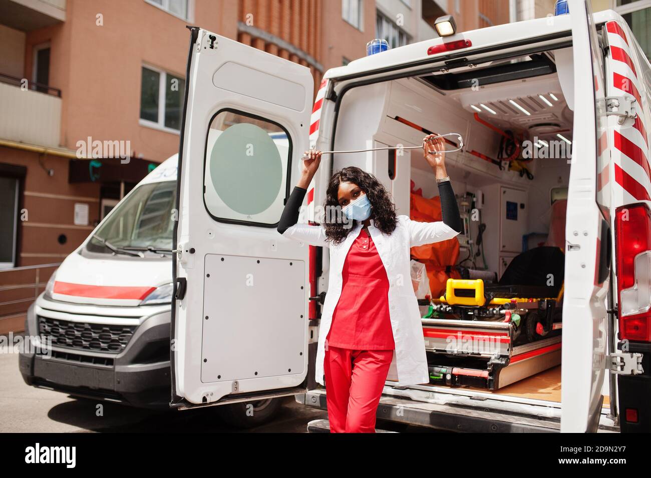 African american female paramedic in face protective medical mask ...