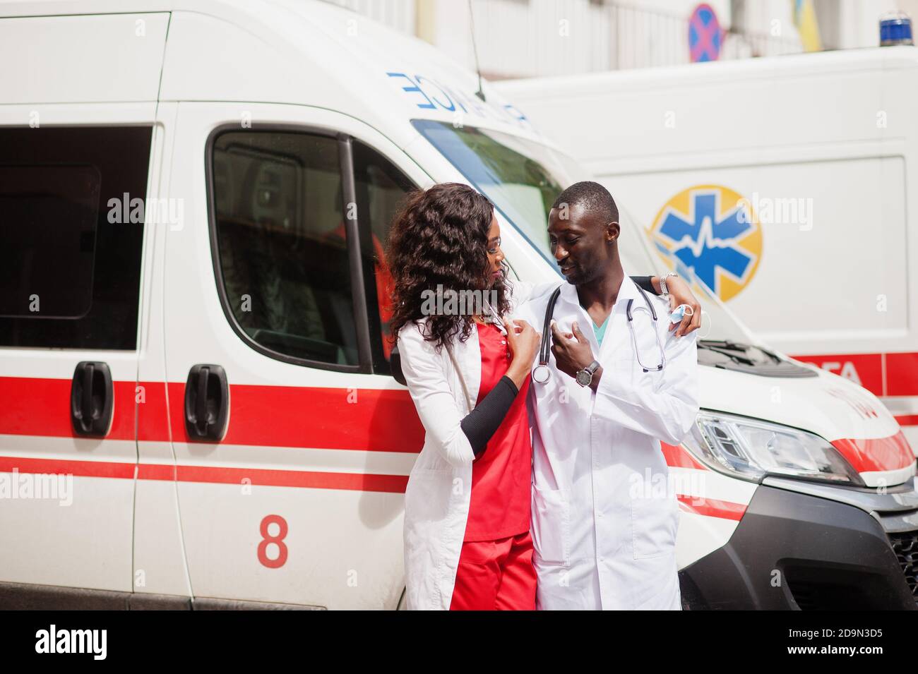 Two african paramedic ambulance emergency crew doctors Stock Photo - Alamy