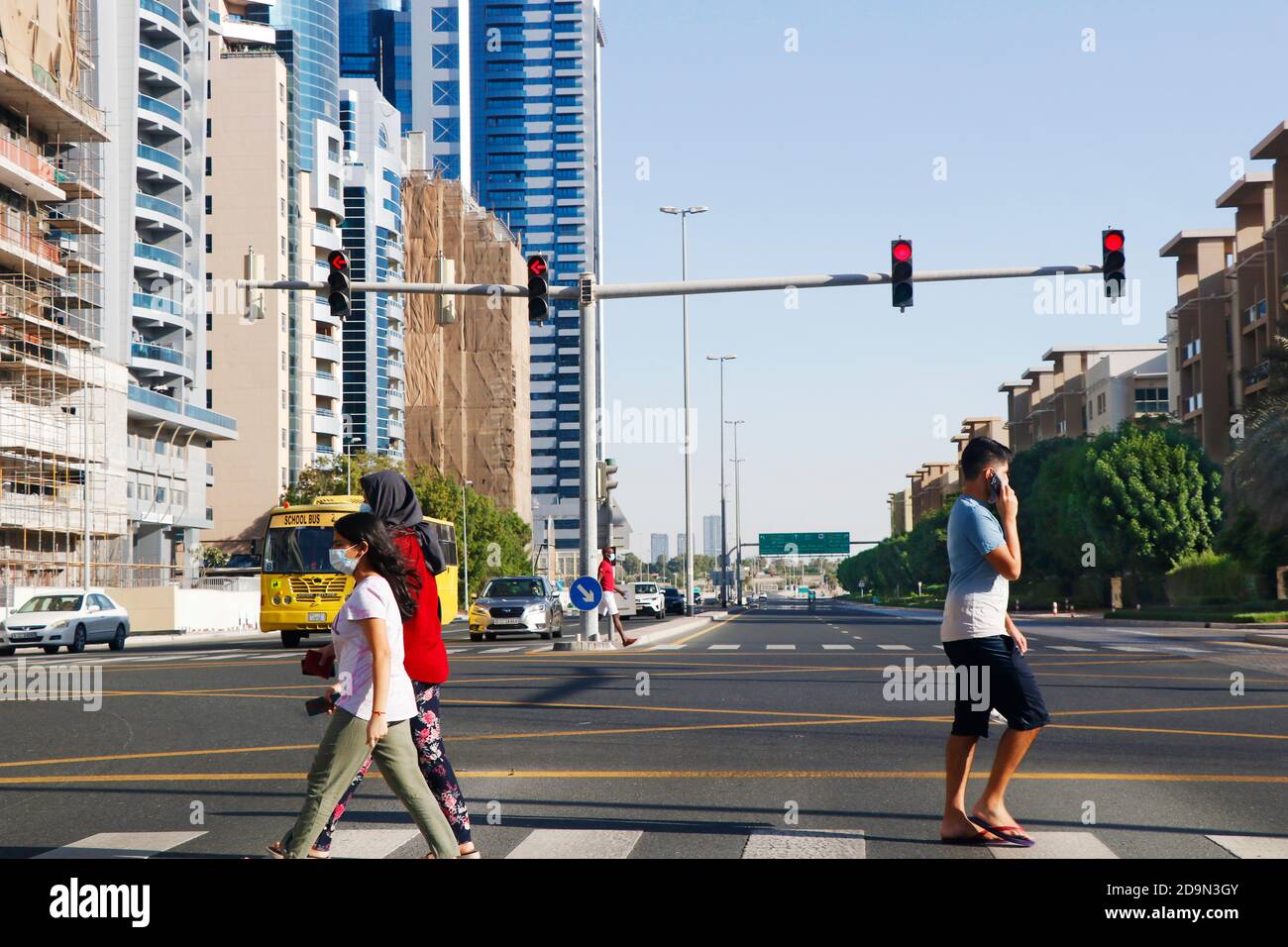 Women walking on pavement dubai hi-res stock photography and images - Alamy