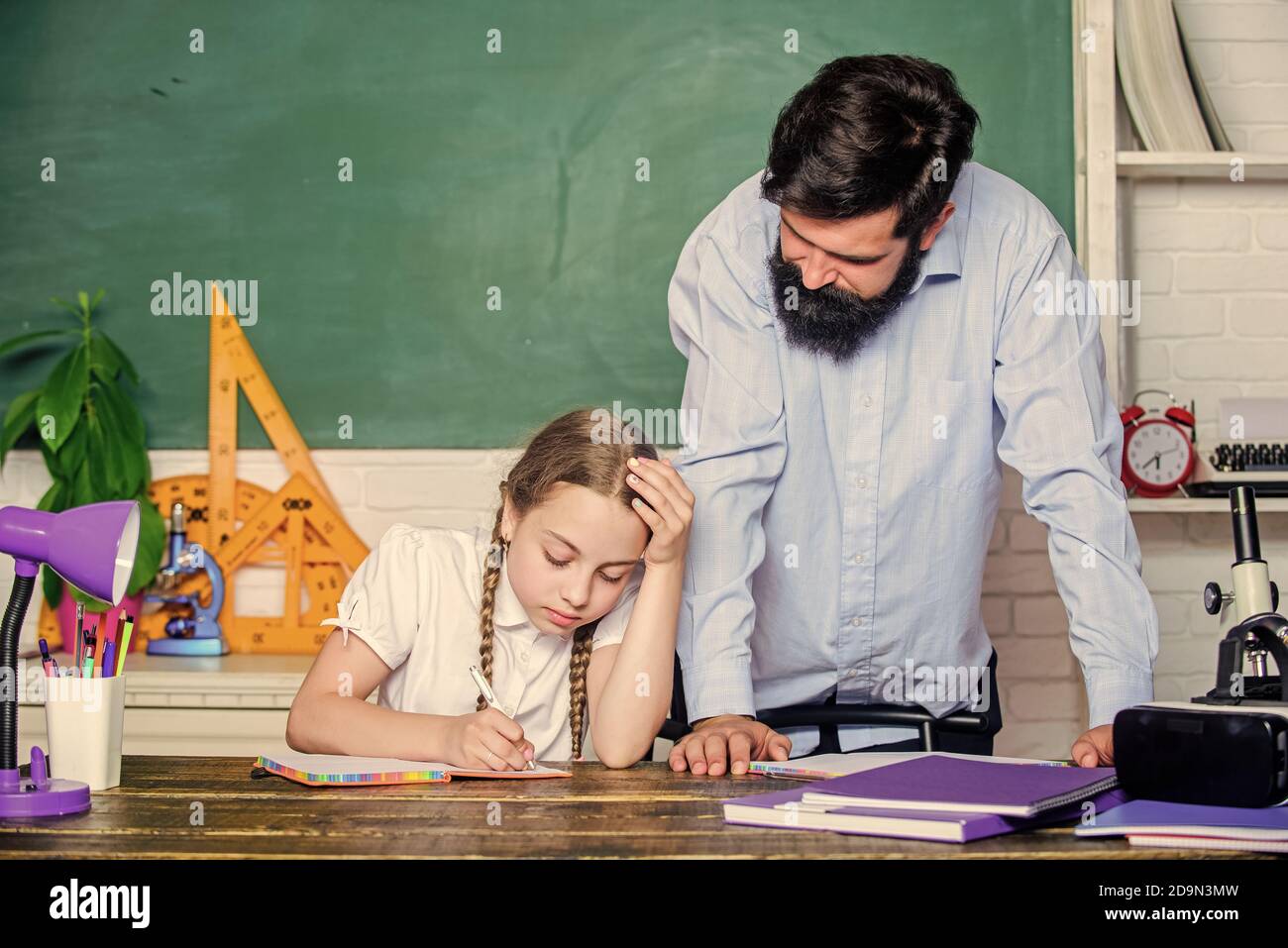 Teacher paperwork with child hi-res stock photography and images - Alamy