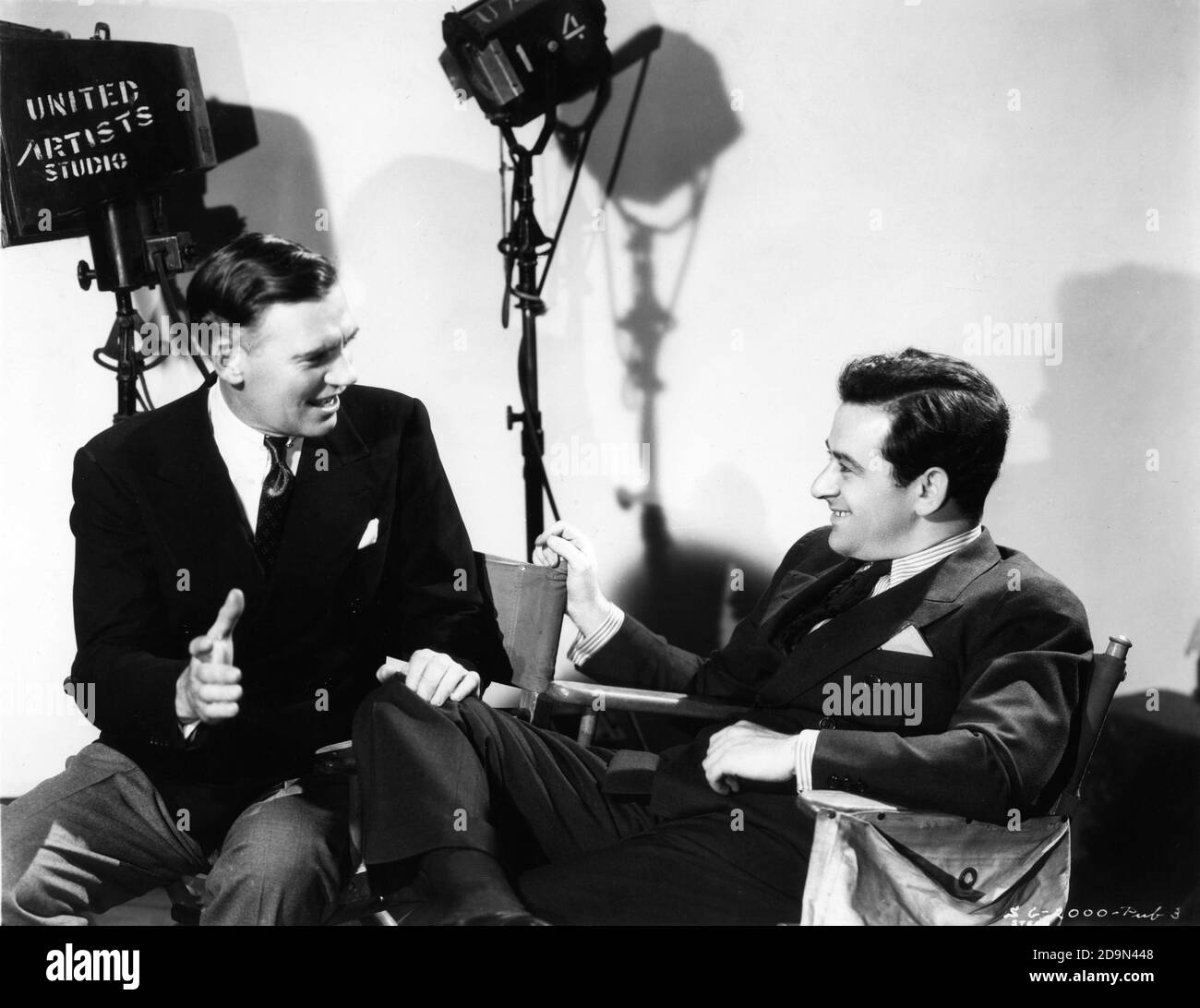 WALTER HUSTON and WILLIAM WYLER on set candid during filming of ...