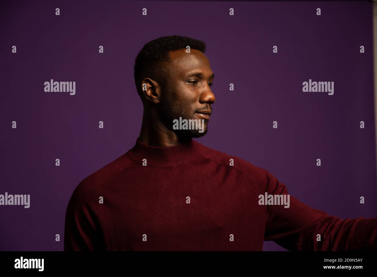 Profile portrait of black man with head turned to side. Isolated ...