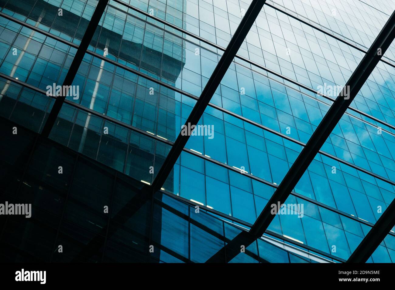 Glass building with sky reflection Stock Photo - Alamy