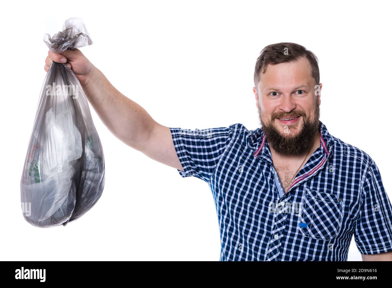 Joyful bearded man in shirt with plastic garbage package waste disposal ...