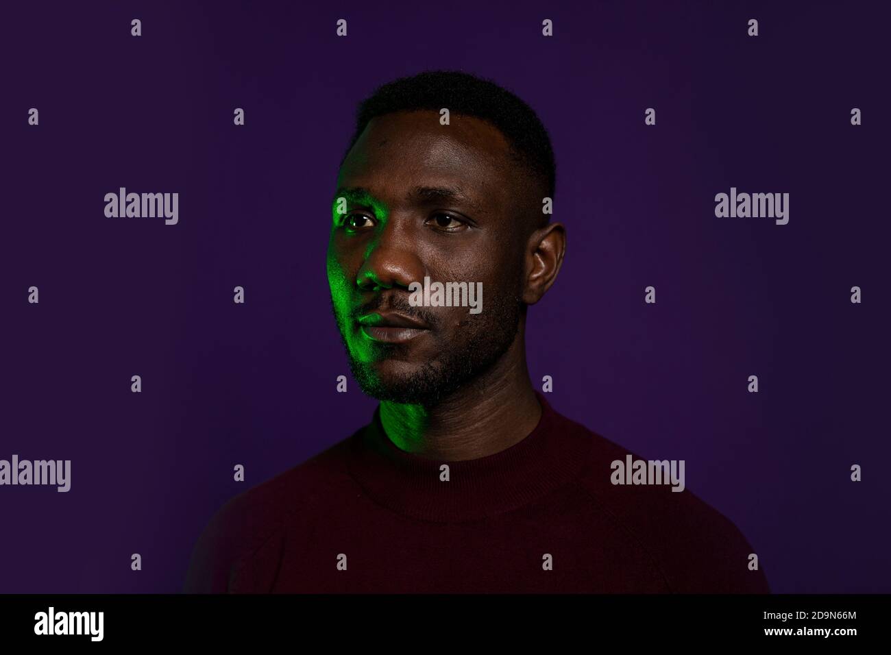 Handsome black man looking away with blank facial expression. Portrait ...