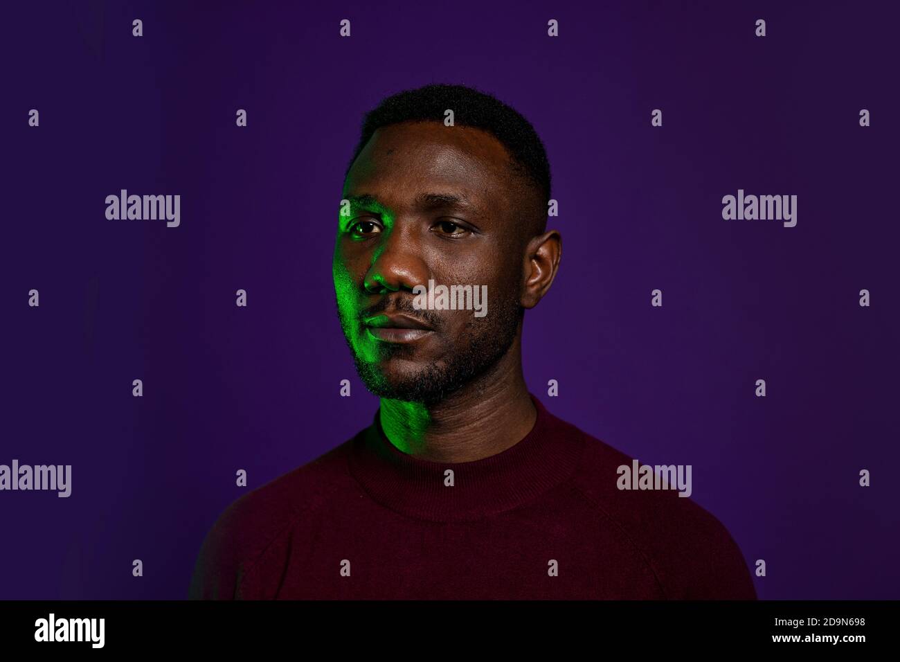 African man portrait with blank facial expression looking away ...