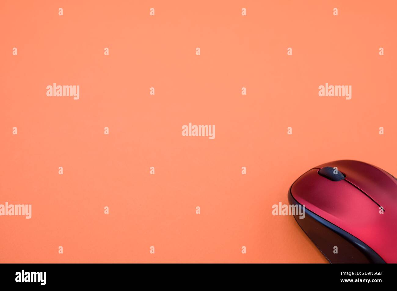 High angle shot of a wireless mouse on an orange surface Stock Photo ...