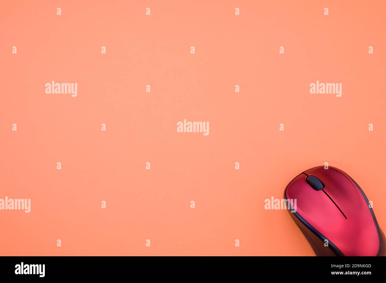 High angle shot of a wireless mouse on an orange surface Stock Photo ...