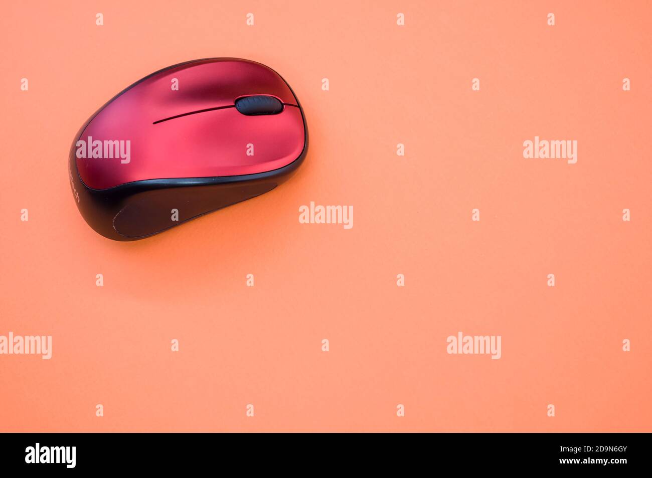 High angle shot of a wireless mouse on an orange surface Stock Photo ...