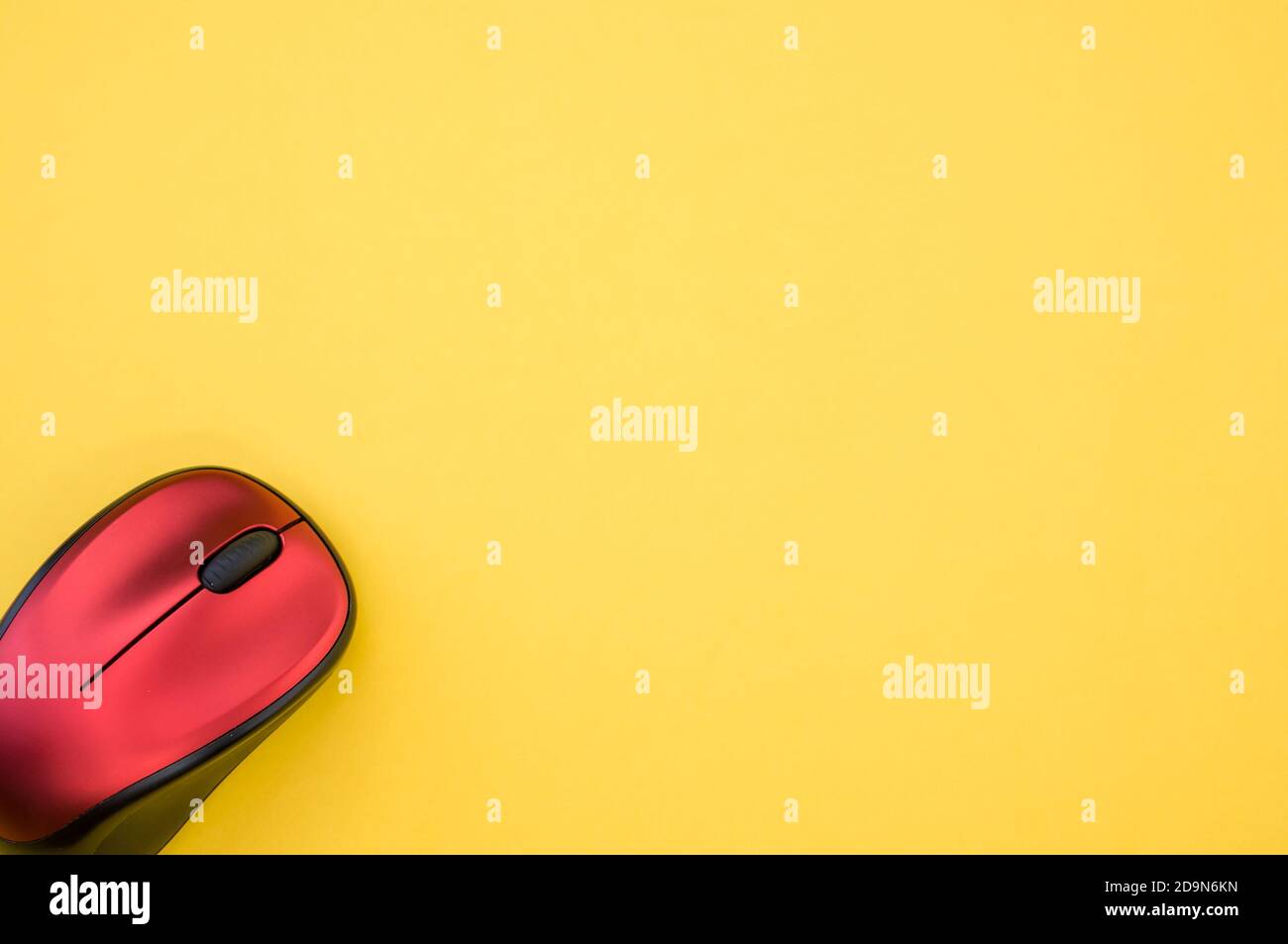 High angle shot of a wireless mouse on a yellow surface Stock Photo - Alamy