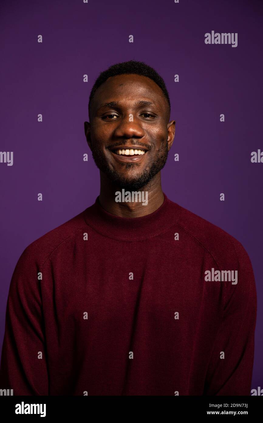 Black man smiling toothy smile on isolated background. Medium shot ...