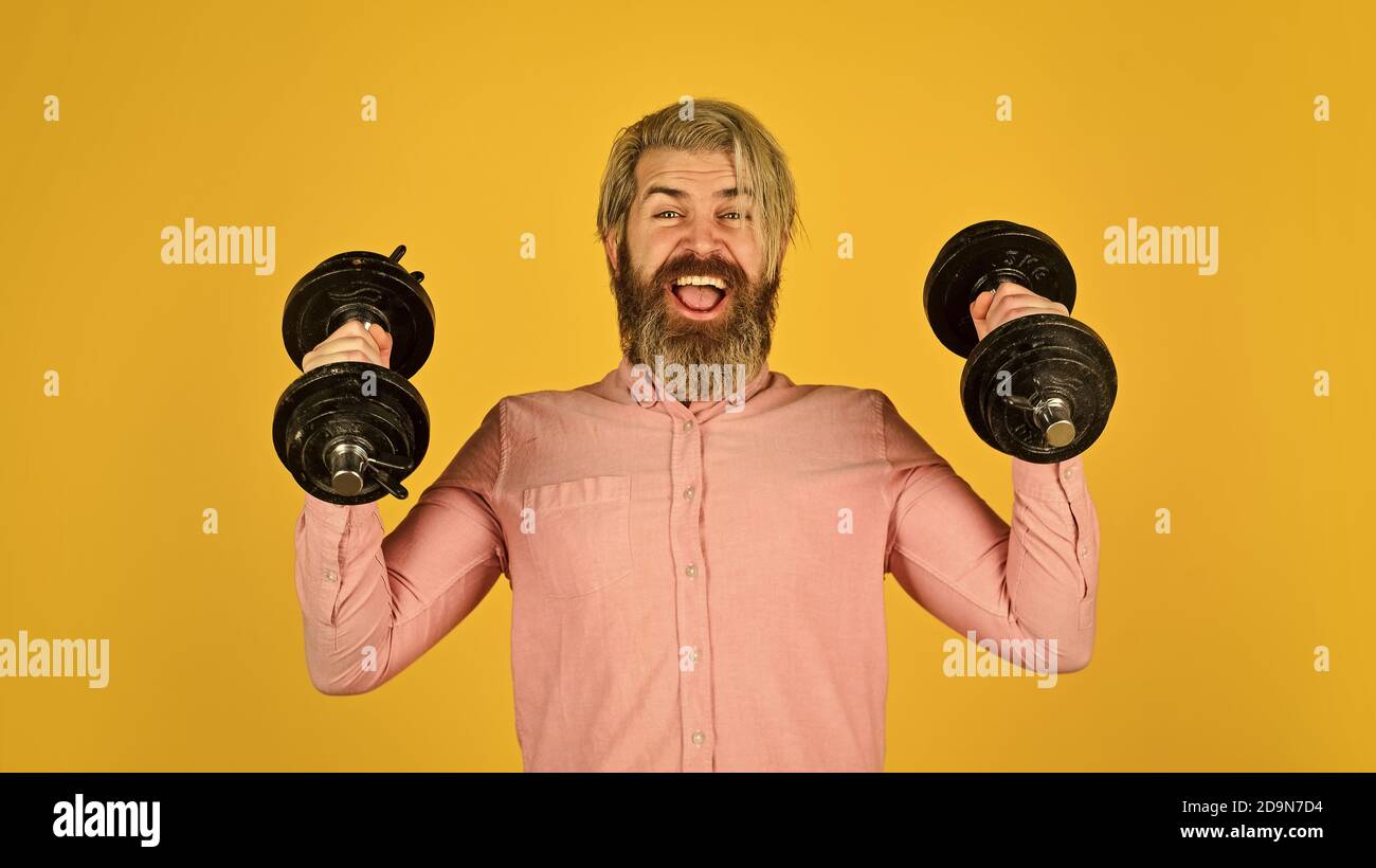 Athletic man pumping biceps dumbbell hi-res stock photography and ...