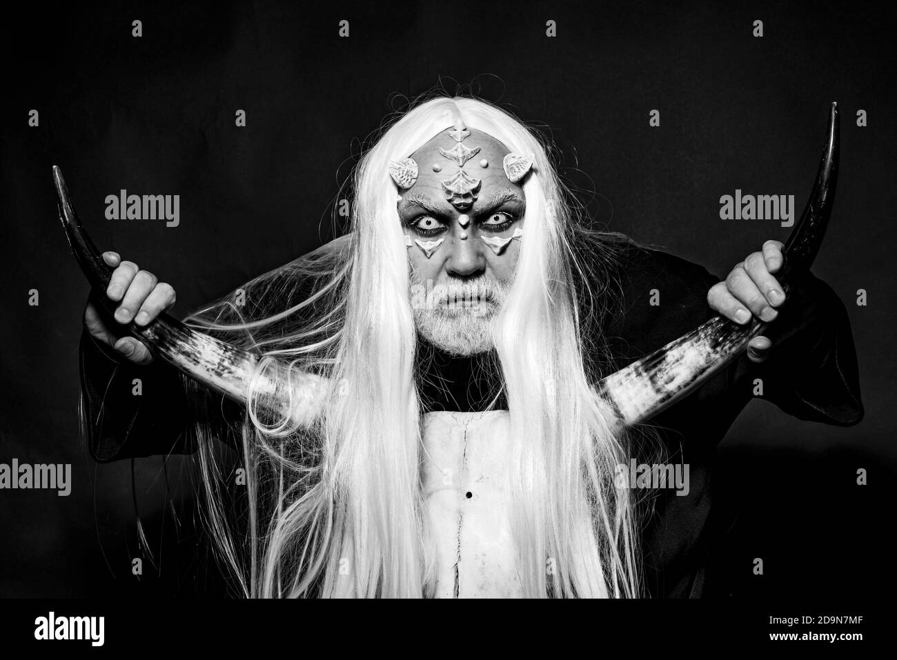 Man evil with horns. Wizard demon man with dragon skin and horns ...