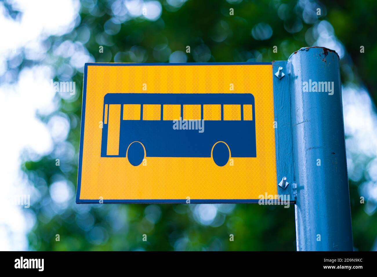 Bus stop sign on a metal pole Stock Photo - Alamy