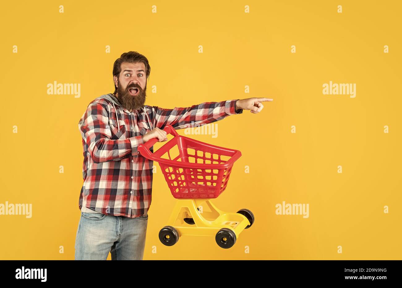 Real shopaholic. buyer in supermarket. empty toy trolley. really busy ...