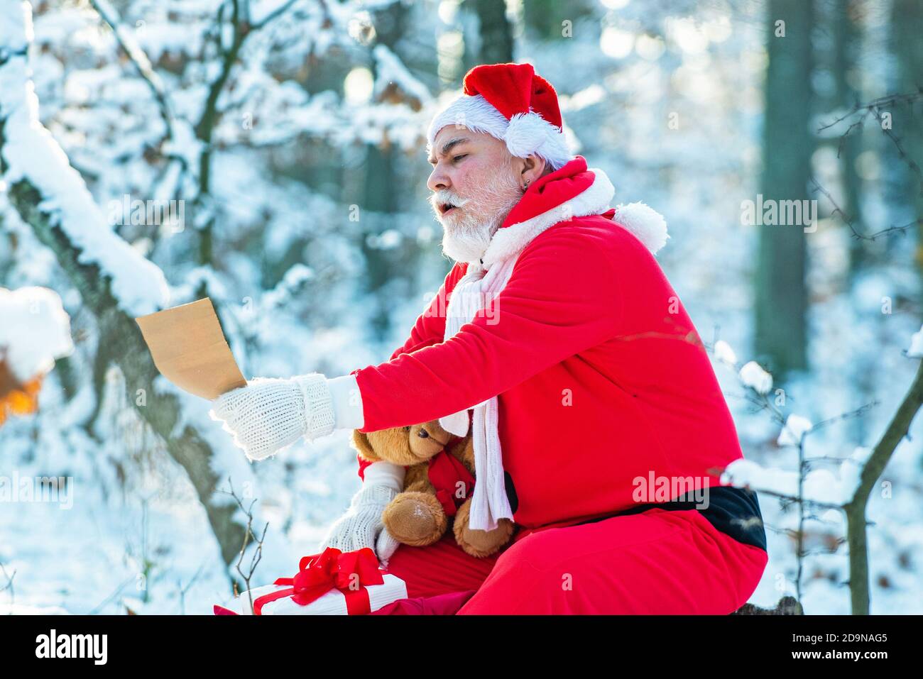 Santa Claus write letters in winter forest. Delivery christmas gifts ...