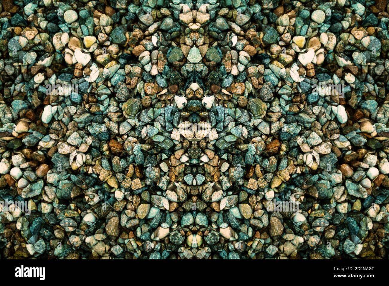 Different colored rocks and pebbles on a beach. Various colors and ...