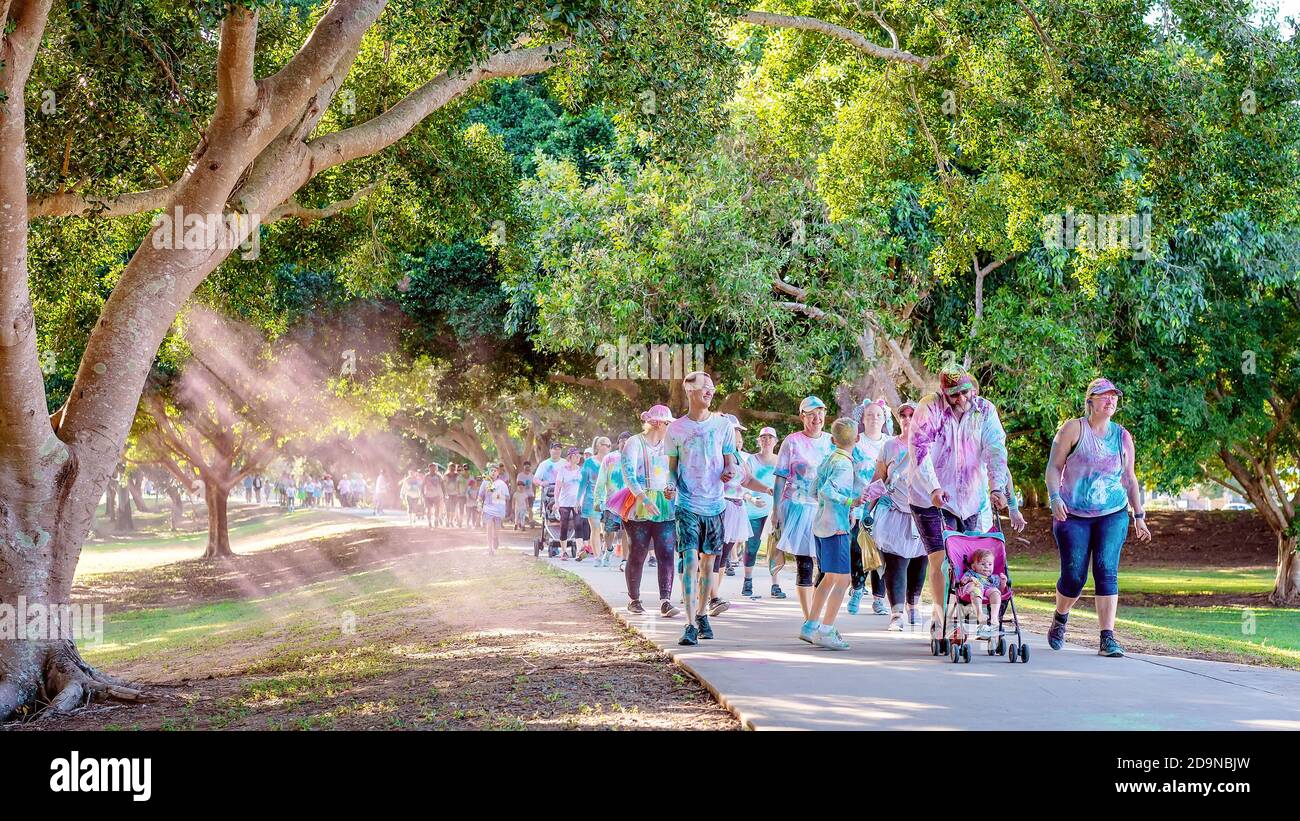 MACKAY, QUEENSLAND, AUSTRALIA - JUNE 2019: Pink powder fills the air as ...