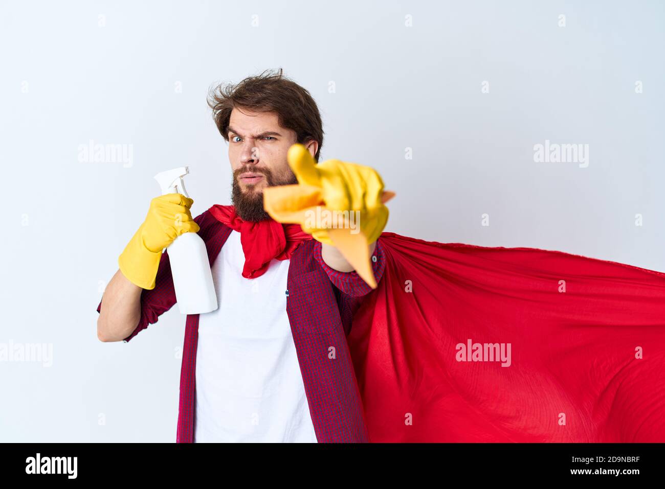 cleaner wearing a red coat detergent service housework Stock Photo - Alamy