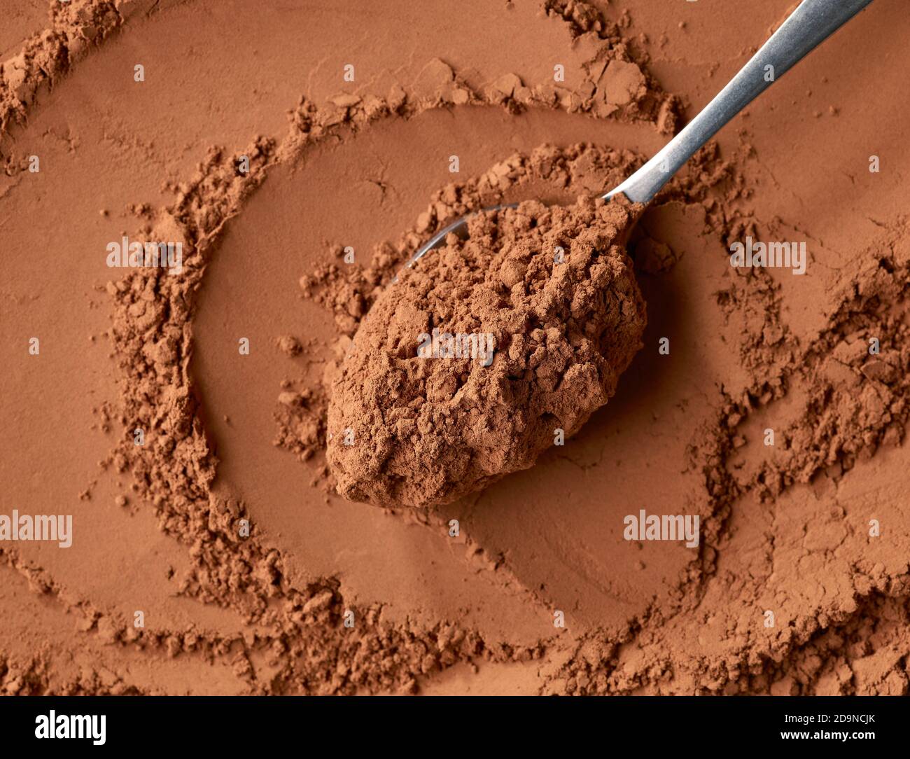 spoon of cocoa powder, top view Stock Photo - Alamy