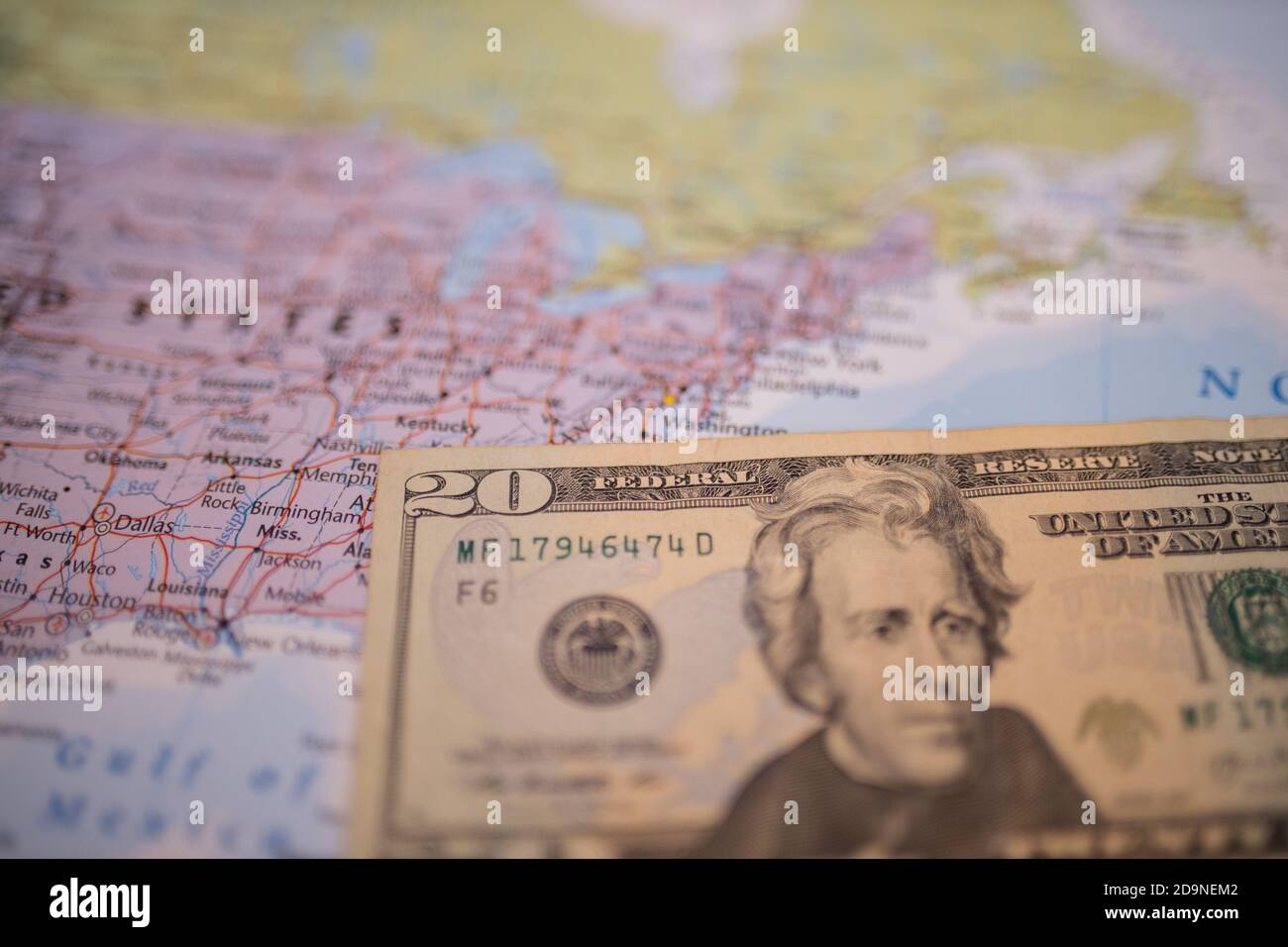 Twenty-dollar bill next to The United States of America on a colorful ...