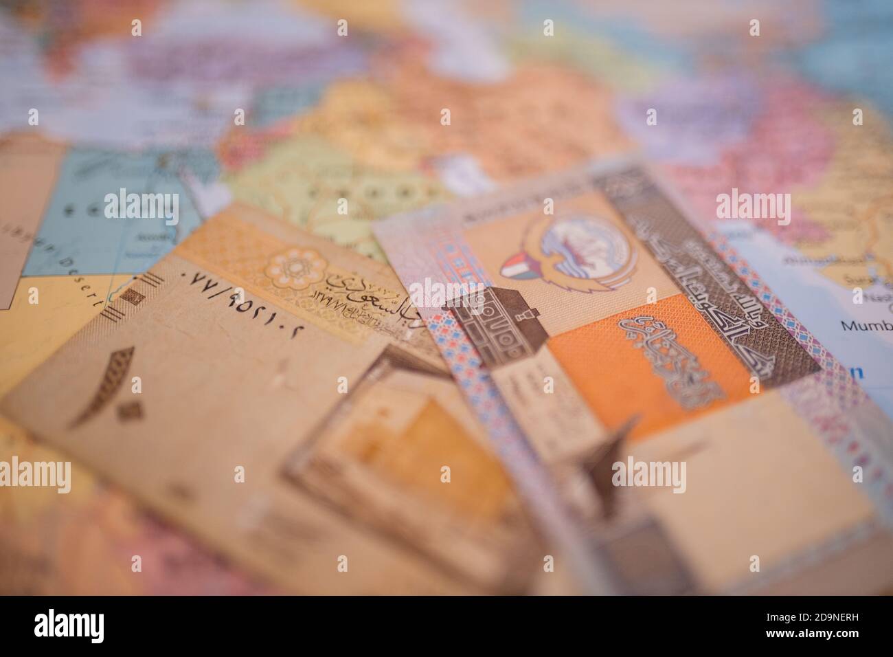 Ten riyals bill and a Quarter Dinar bill above Saudi Arabia on a ...
