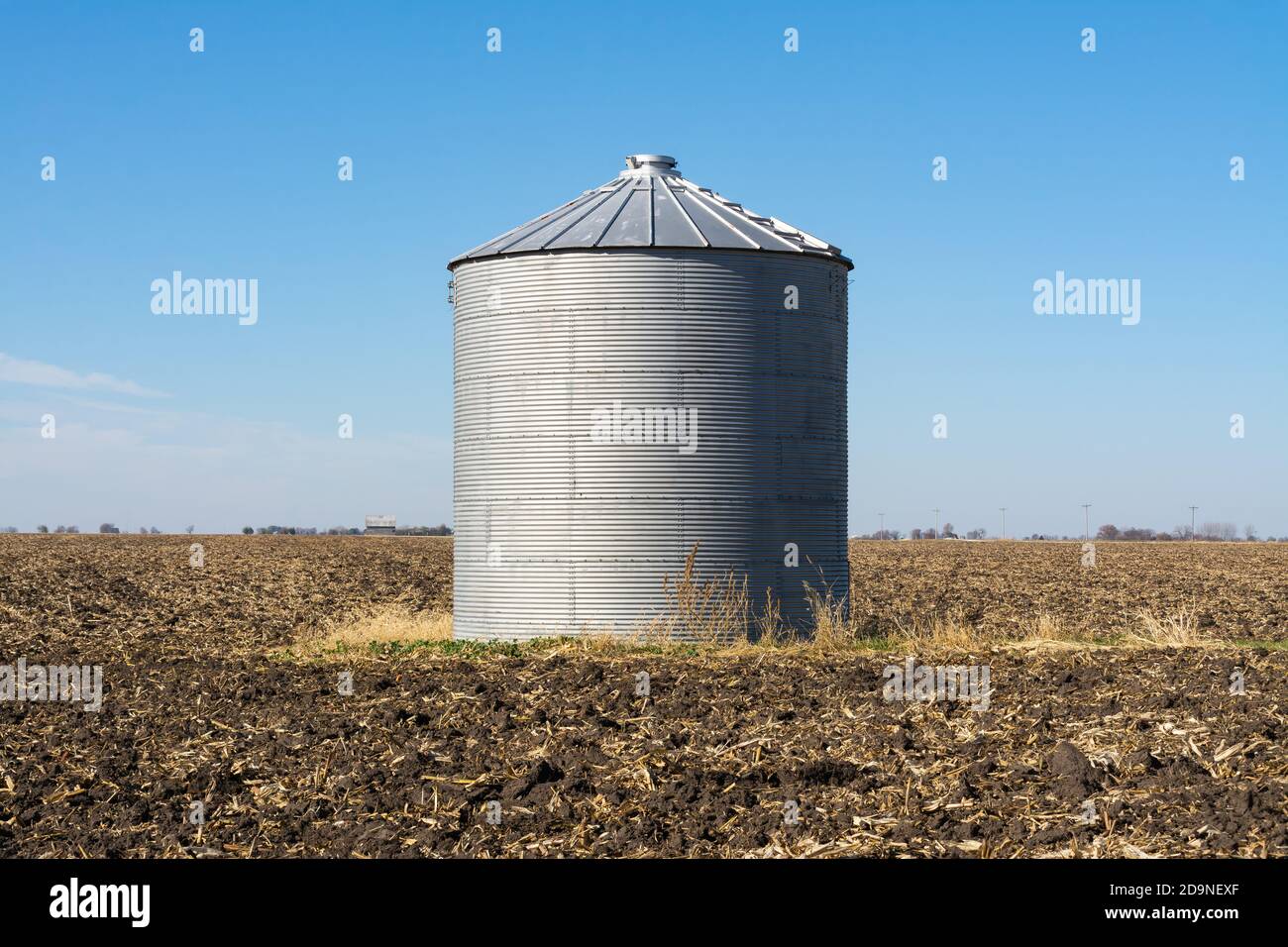 Metal silo in open field Stock Photo - Alamy