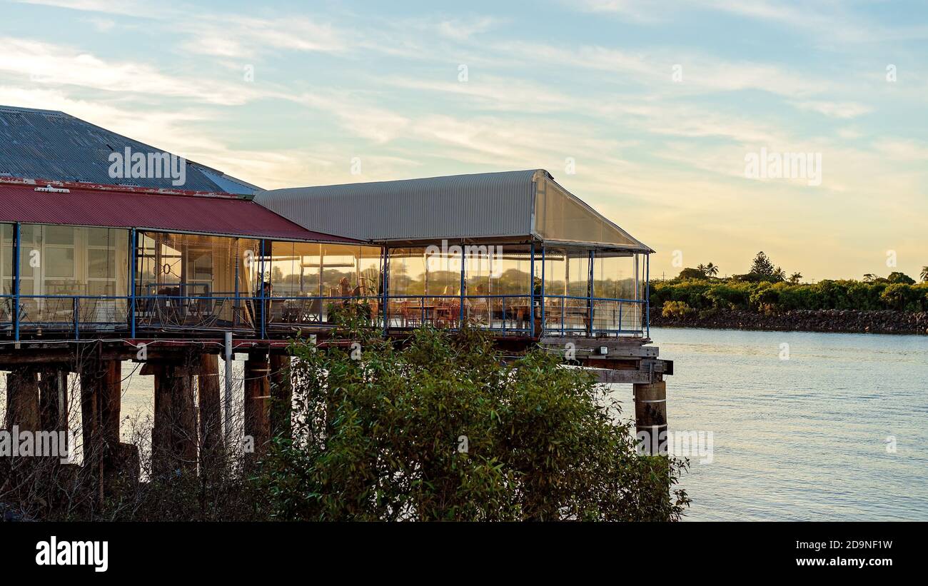 Mackay, Queensland, Australia - 12th July 2019: People dining at sunset ...