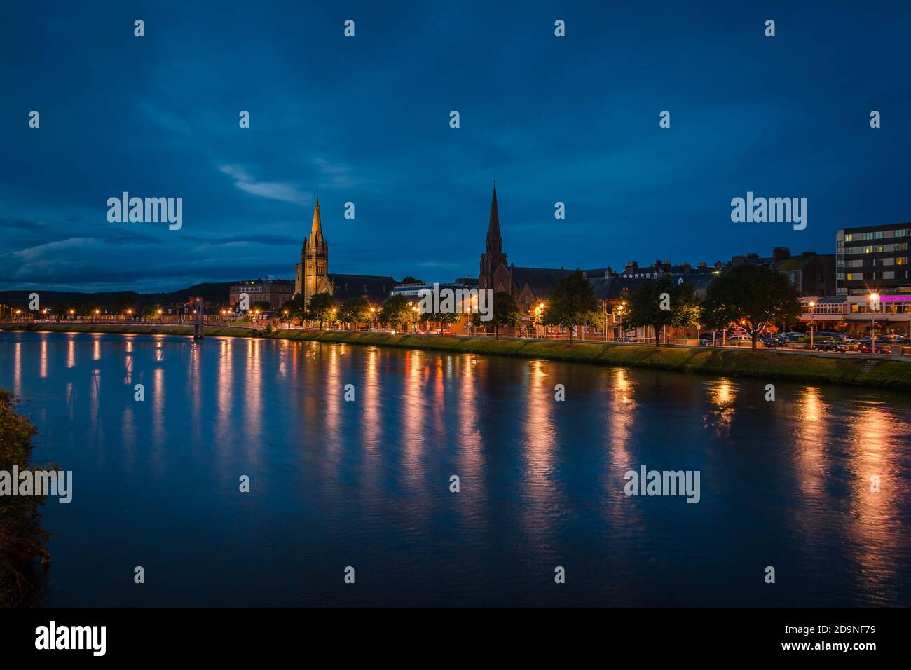 Inverness city landscape at night with the lights reflected in the ...