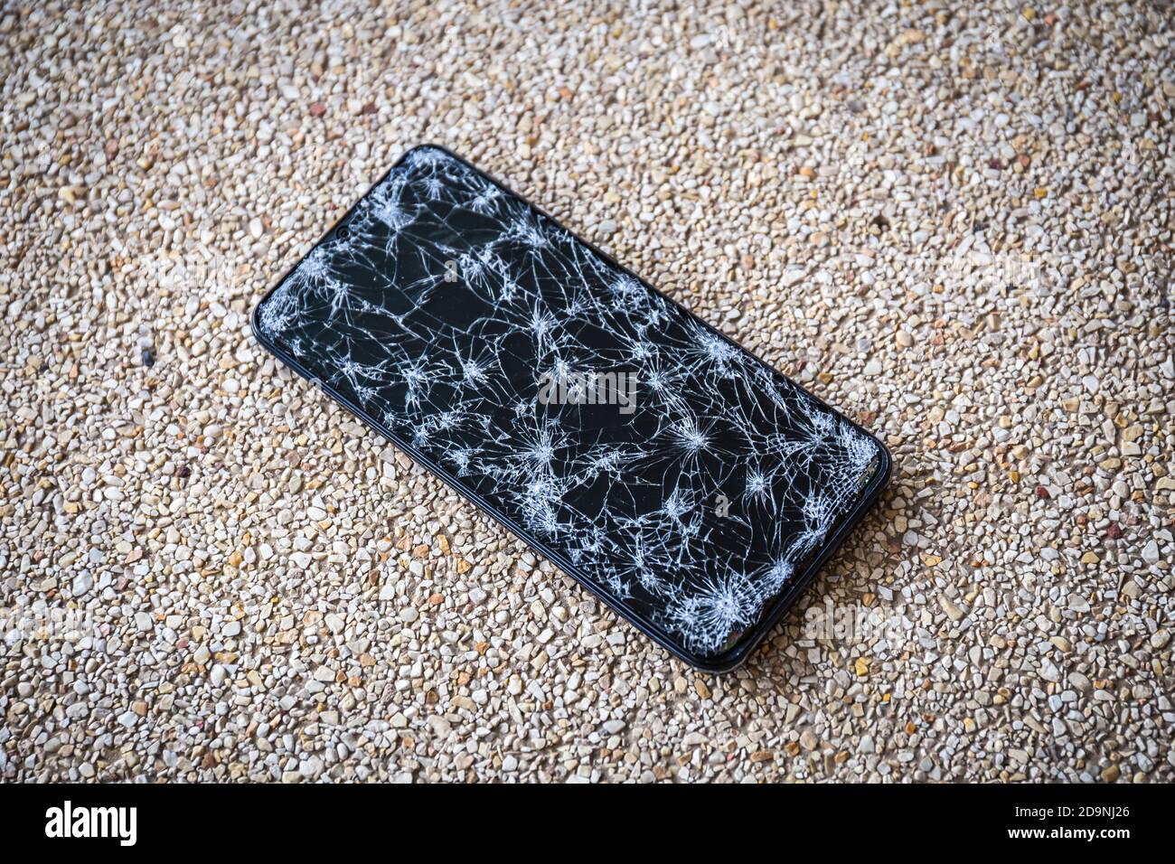 Closeup of Modern mobile smart phone with broken, cracked screen on ...