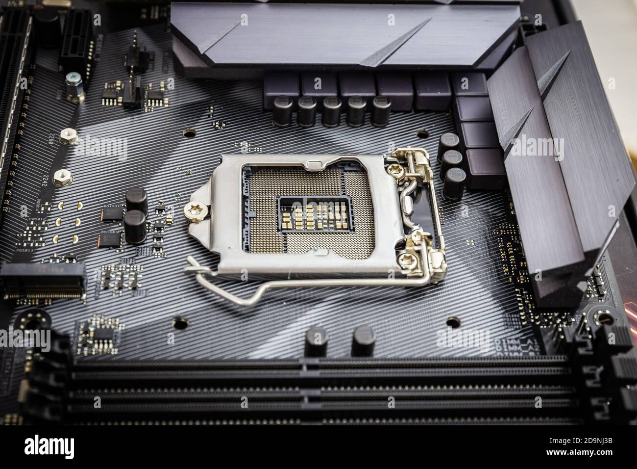 Closeup detail of CPU socket of a modern computer black motherboard ...