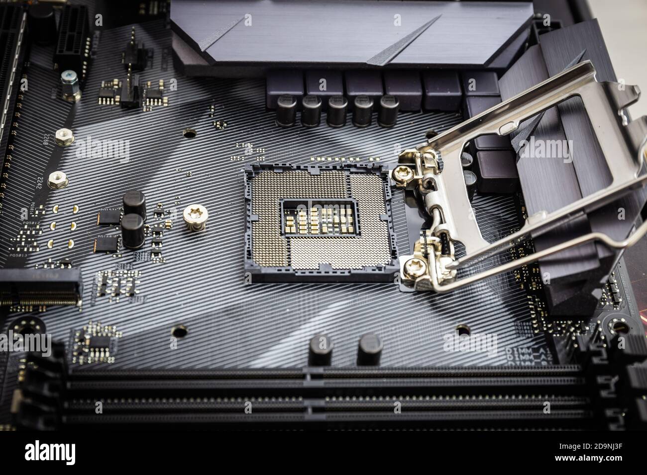 Closeup detail of CPU socket of a modern computer black motherboard ...