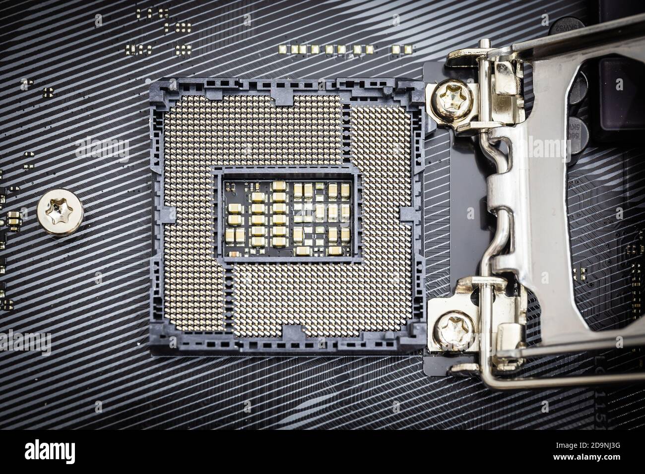 Closeup detail of CPU socket of a modern computer black motherboard ...