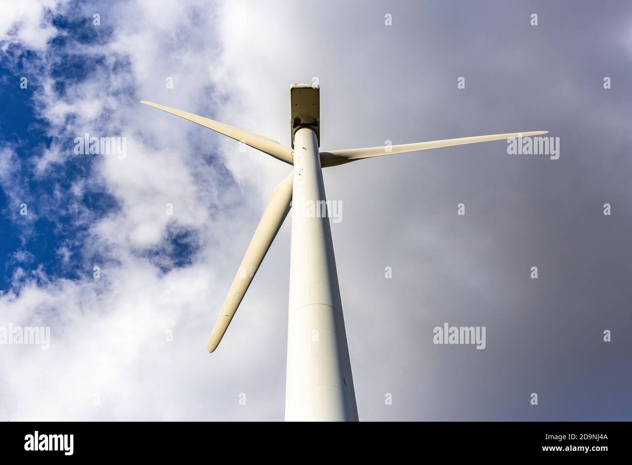 Low angle shot of a single windmill for electric power production with ...