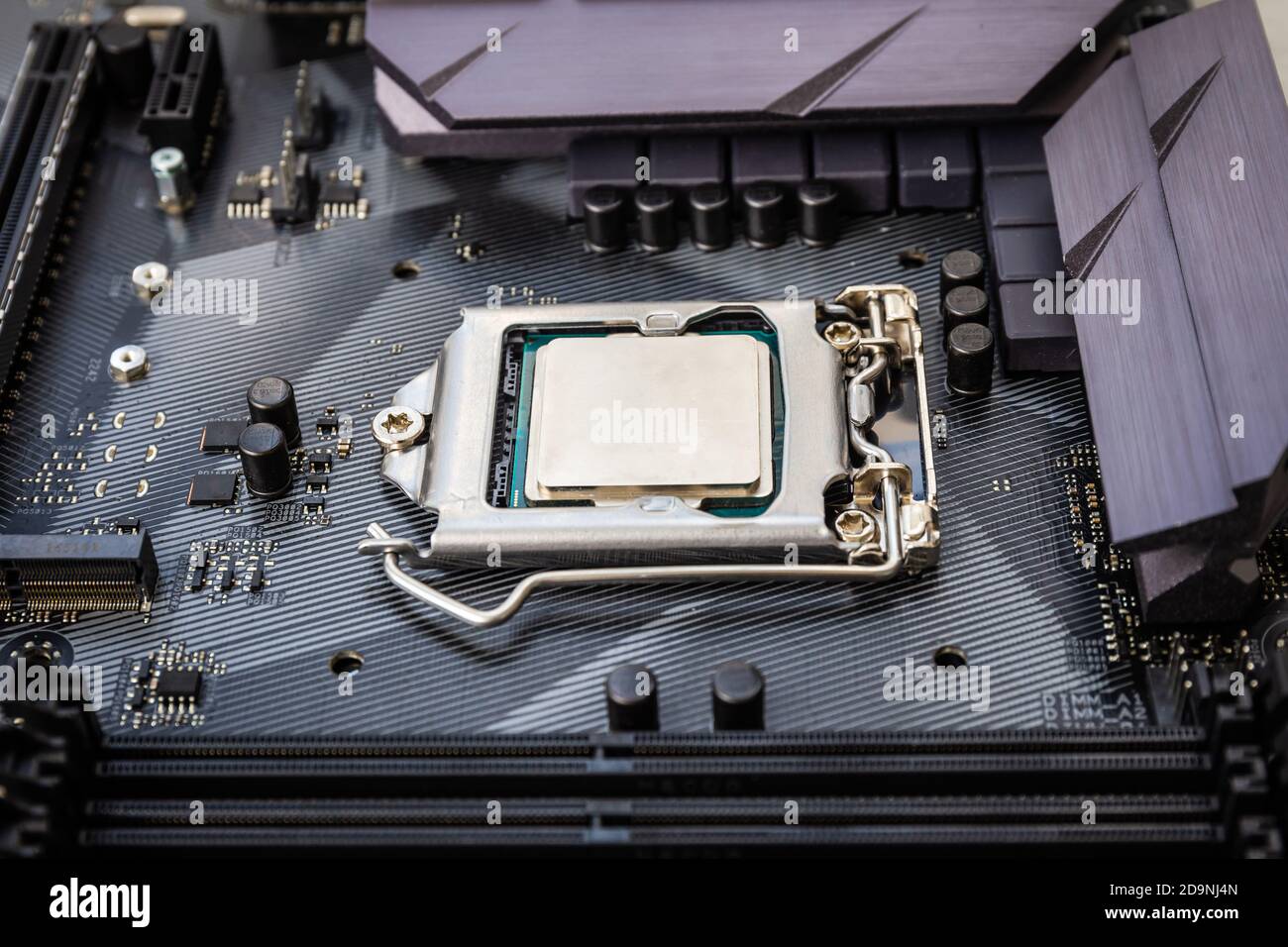 Closeup detail of CPU Chip over socket of a modern computer black ...