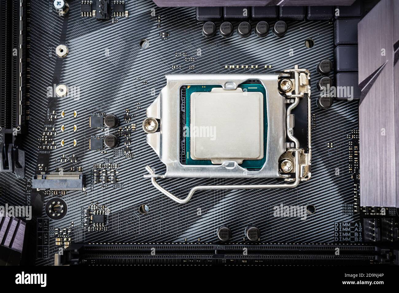 Closeup detail of CPU Chip over socket of a modern computer black ...