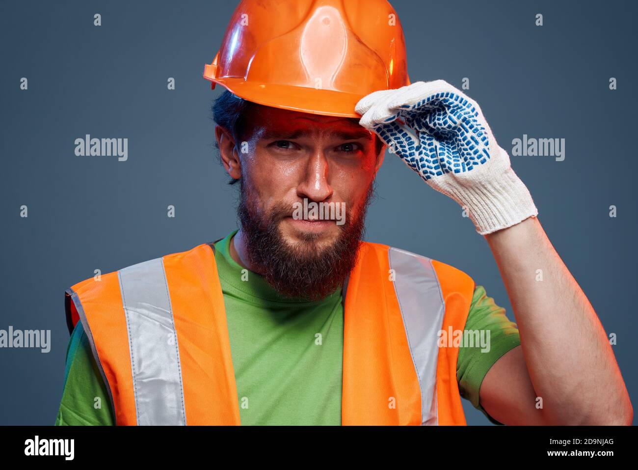 Emotional man on orange paint professional builders work Stock Photo ...
