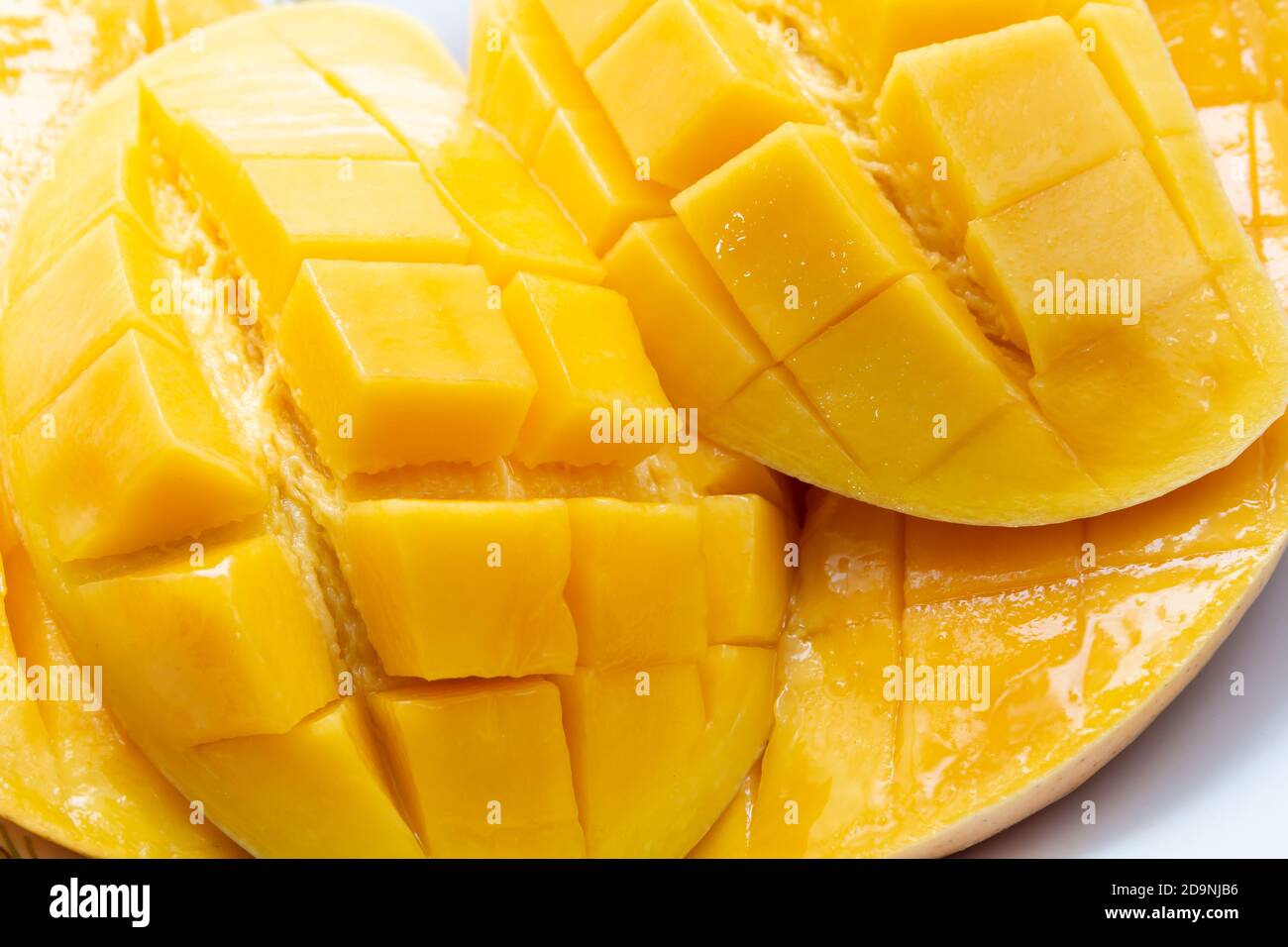 Closeup of Barracuda Mango Fresh and juicy isolated white background ...